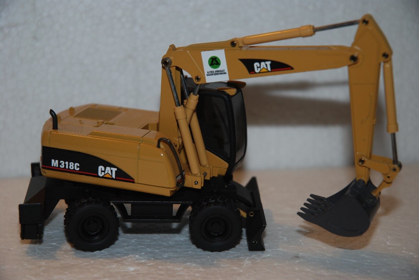 NZG Model Construction Issue Comprising No.405 CAT M318 Wheeled Excavator - Darlington Diecast